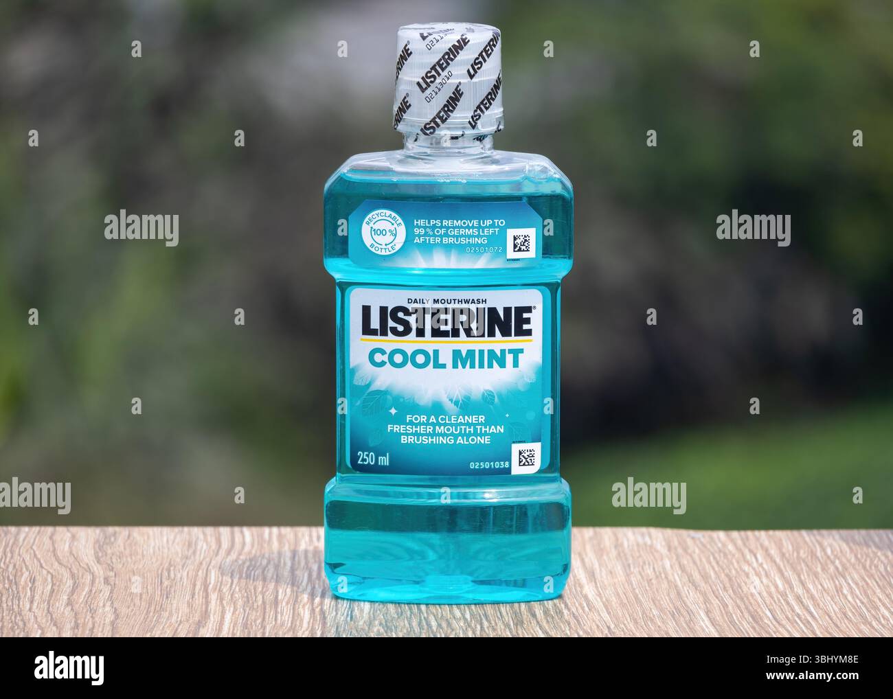 Listerine Cool Mint 250ml mouthwash bottle on wood with green nature ...