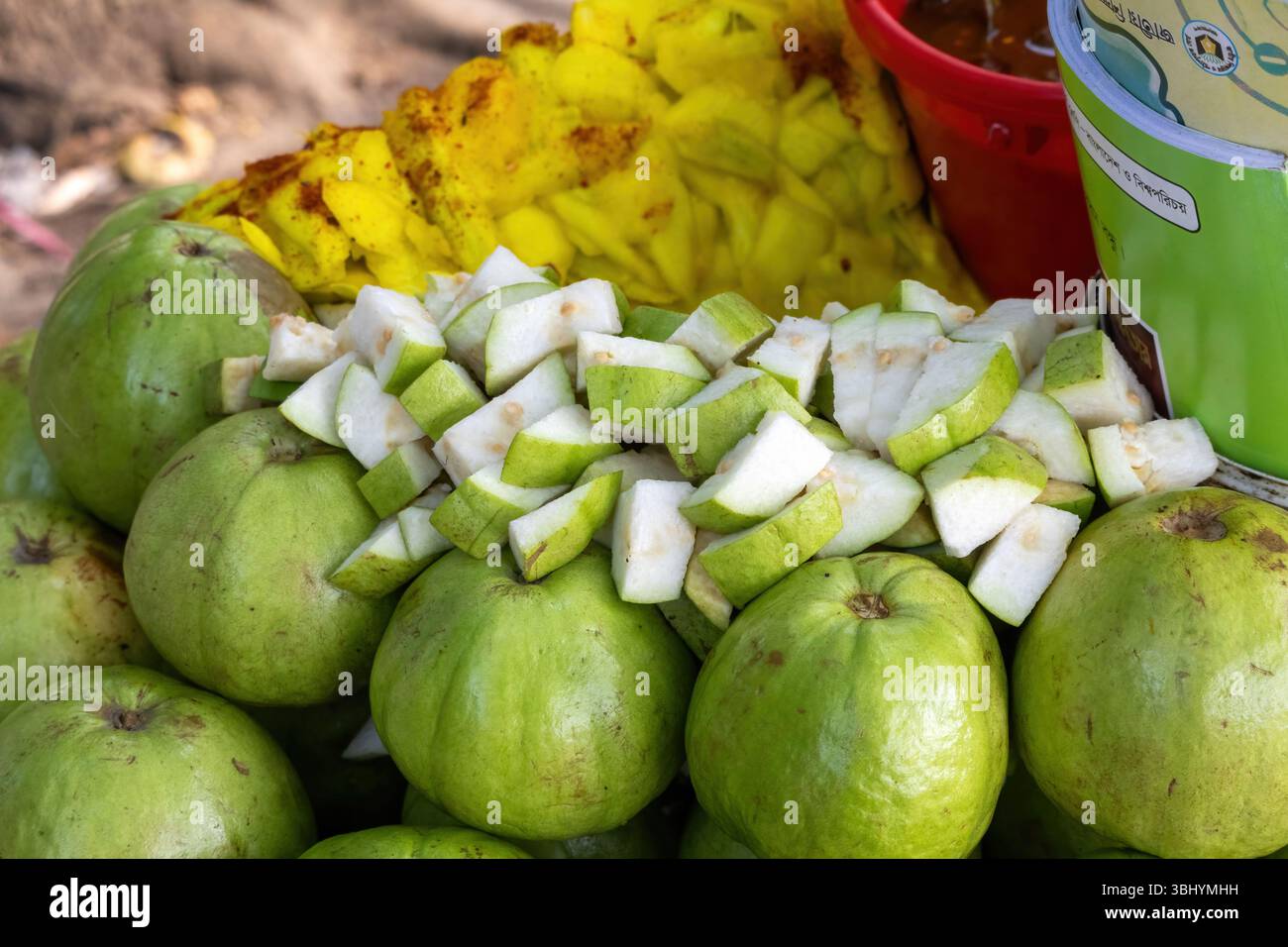 Fresh guava fruits and sliced guava at a street fruit shop in ...