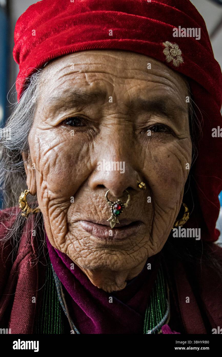 An Elderly Lady of the Tamang Community wearing a Bulaki, a traditional ...