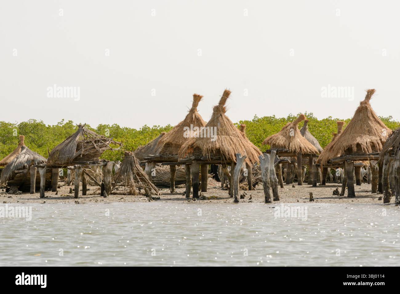 Grain is stored in granaries on stilts at Joal-Fadioth (Joal-Fadiot ...
