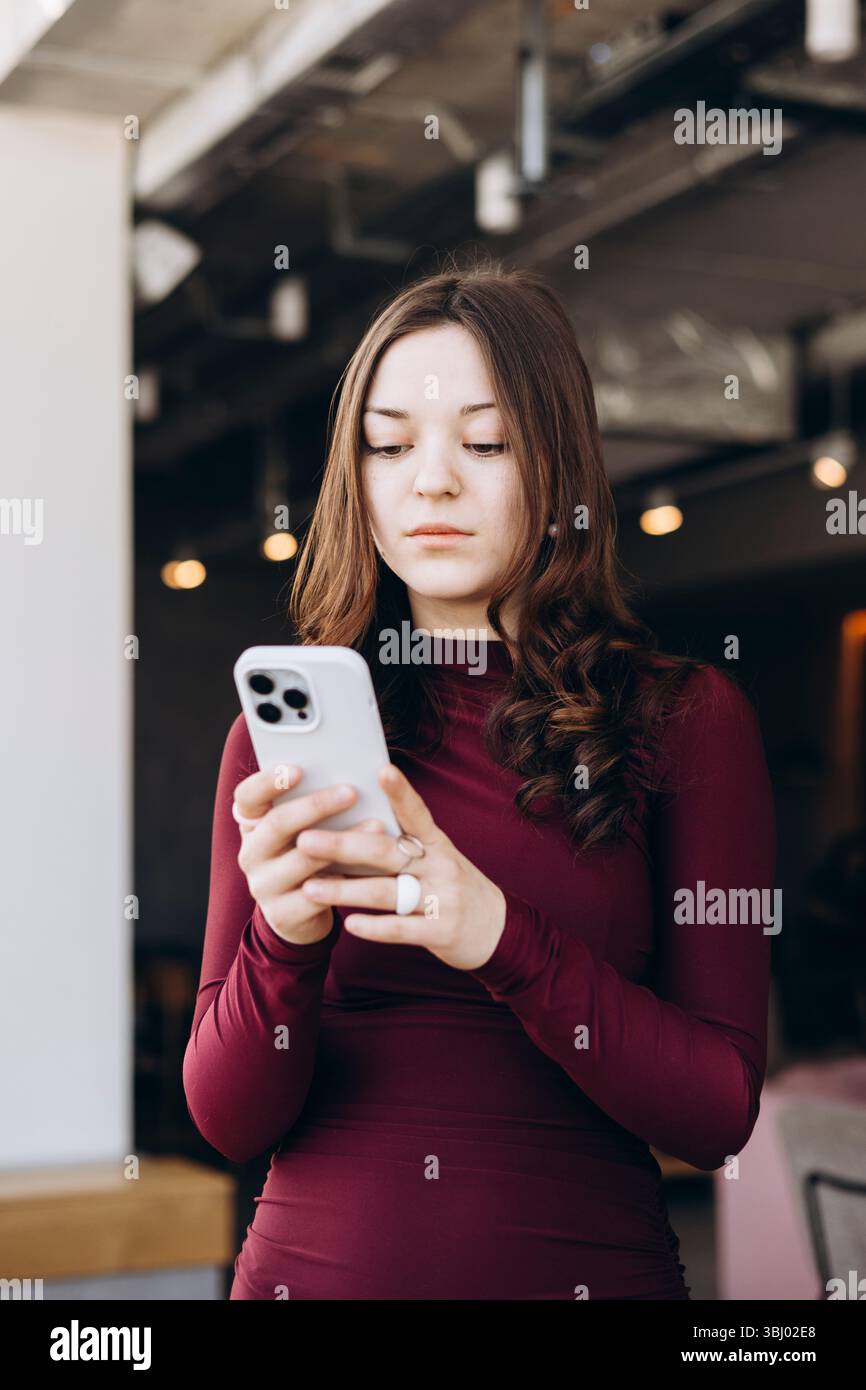 Young people wearing maroon hi-res stock photography and images - Alamy