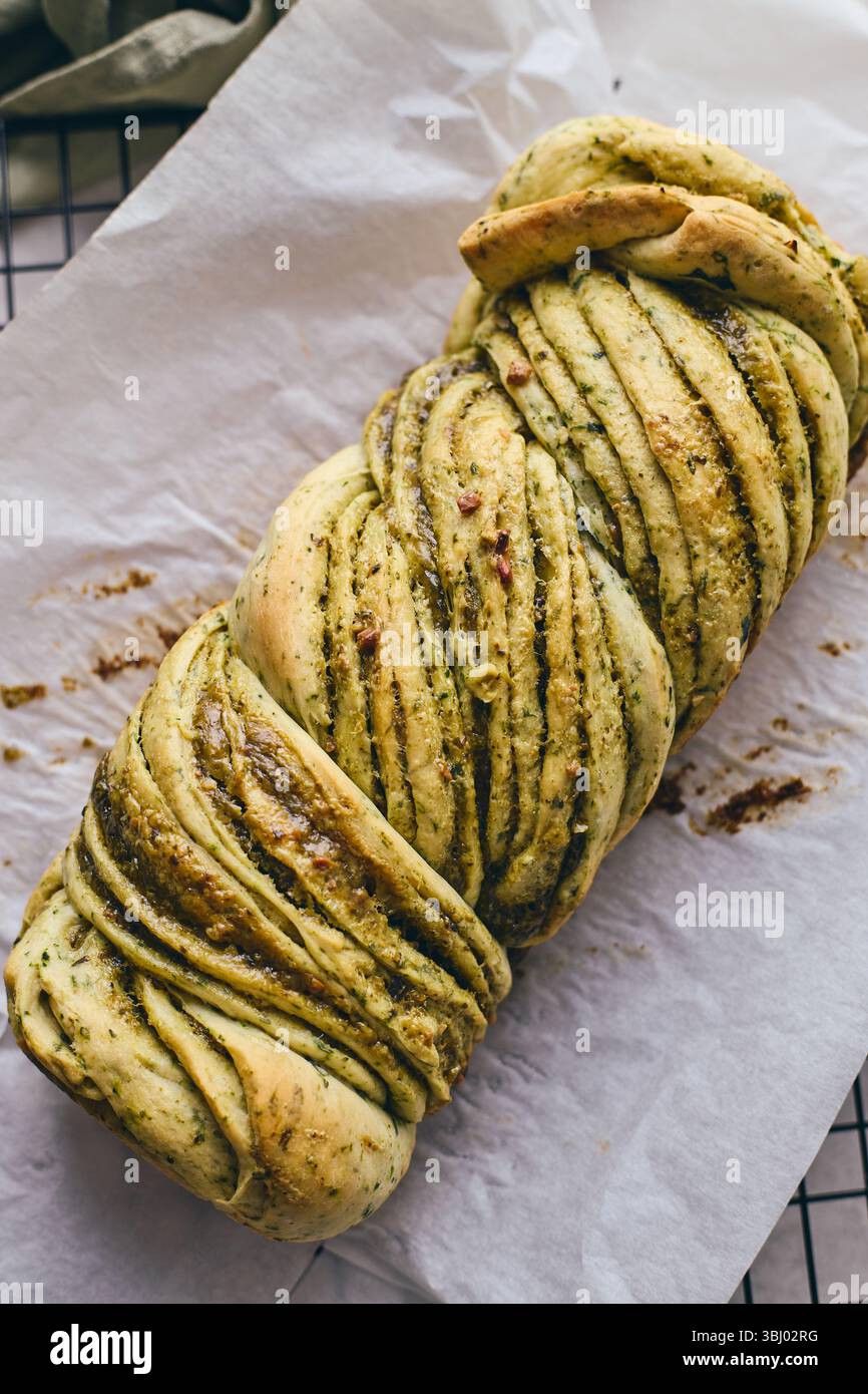 Baked homemade savoury babka plaited bread loaf flavoured with pesto ...