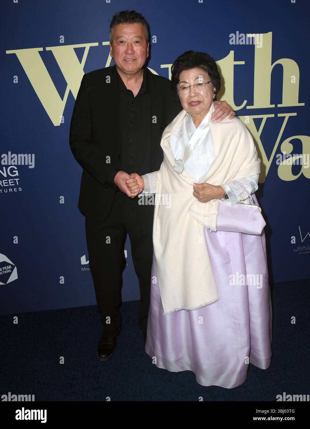 Actor George Lee and his mother Boon Lee attend the Los Angeles ...