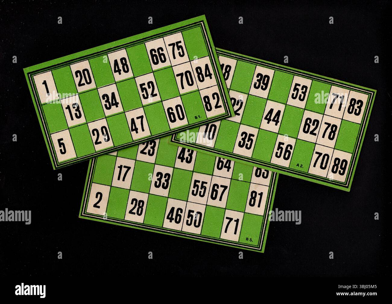 Vintage lotto or bingo cards on a black background Stock Photo - Alamy