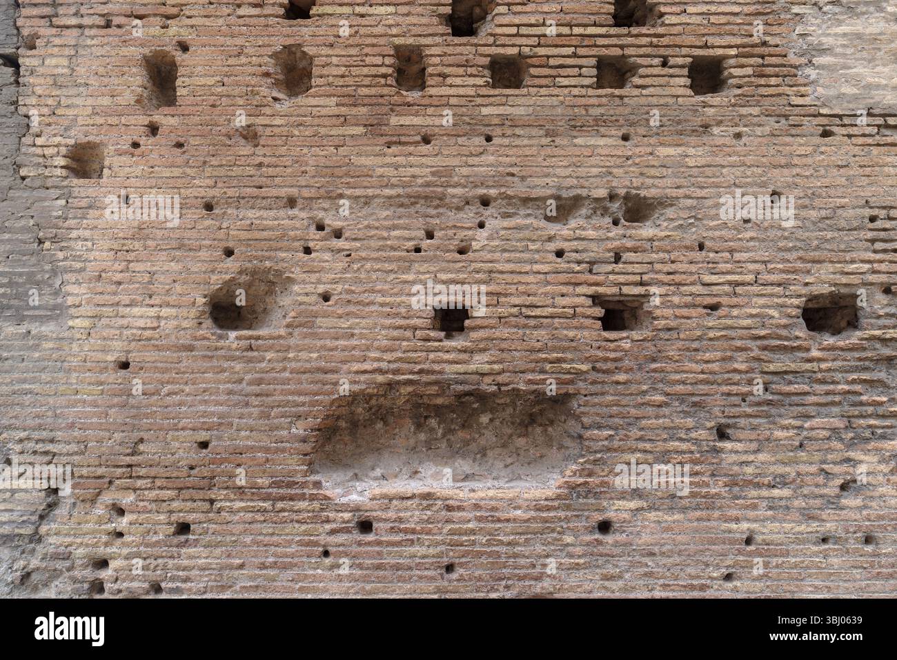 Weathered ancient Roman brick wall revealing aged surface, eroded ...