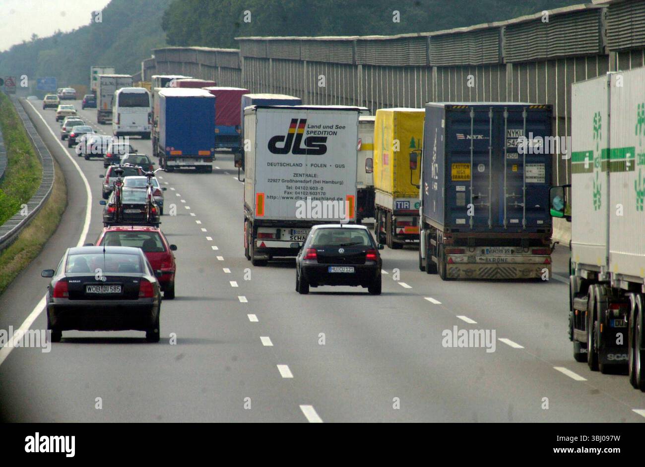 trucks driving on a highway or freeway, road traffic and transportation ...