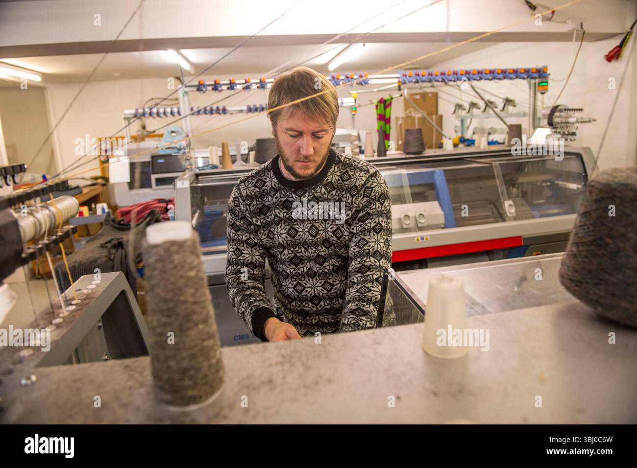 Skilled workers at Shetland Woollen Co. craft traditional knitwear ...