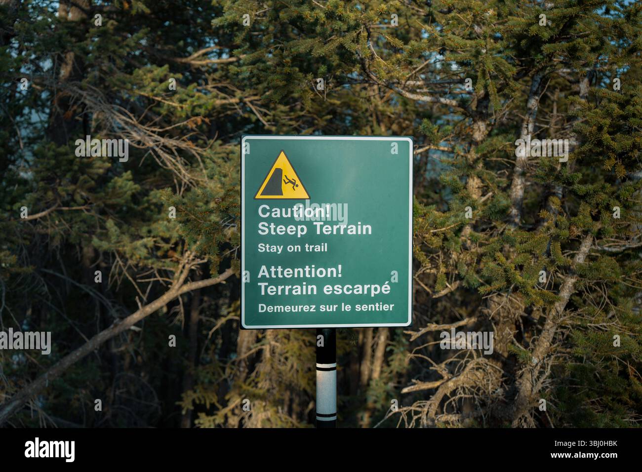 Warning sign Steep Terrain in English and French (Canada Stock Photo ...