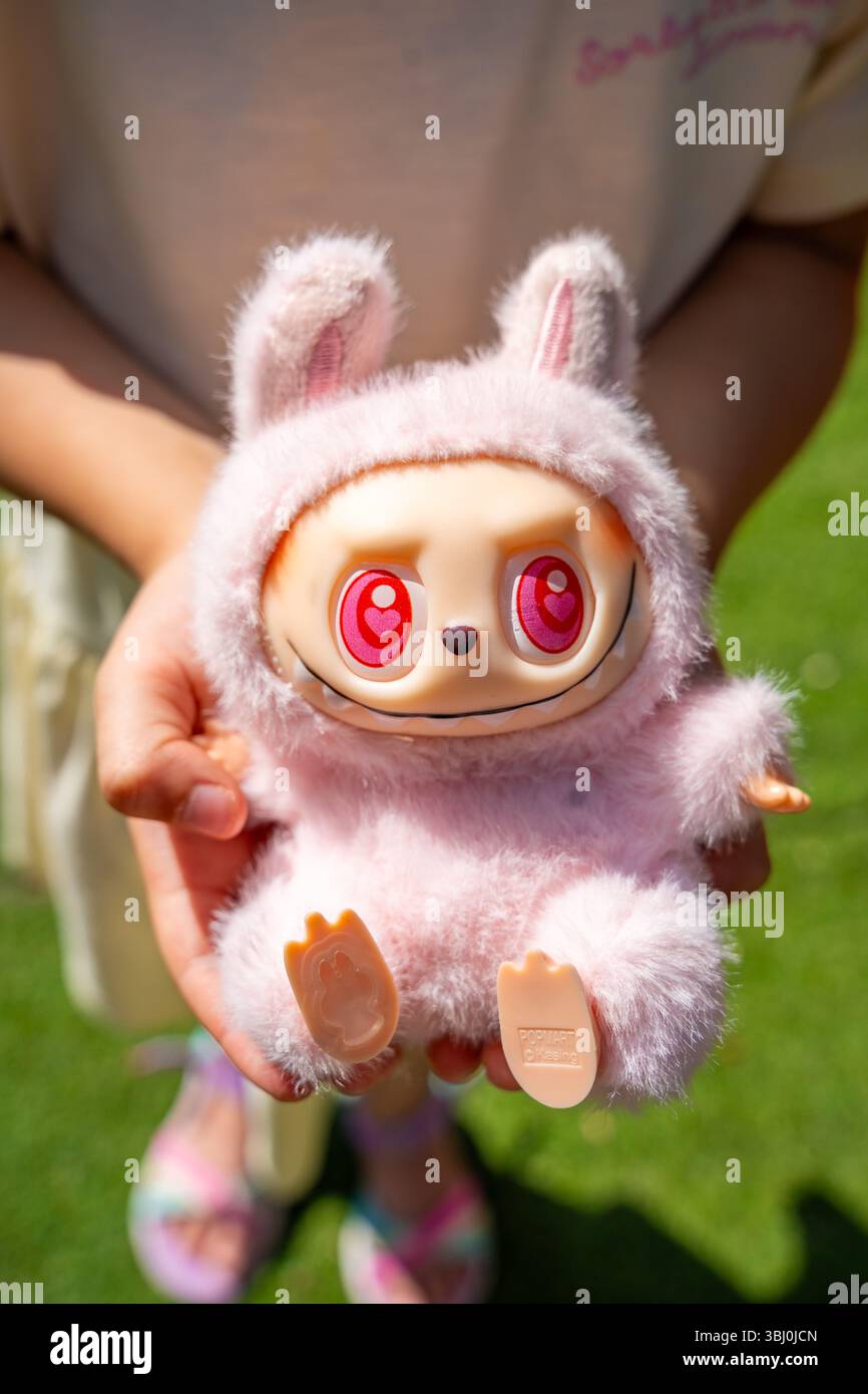 Budva, Montenegro - June 12, 2025: Close-up of pink Dada figure from ...