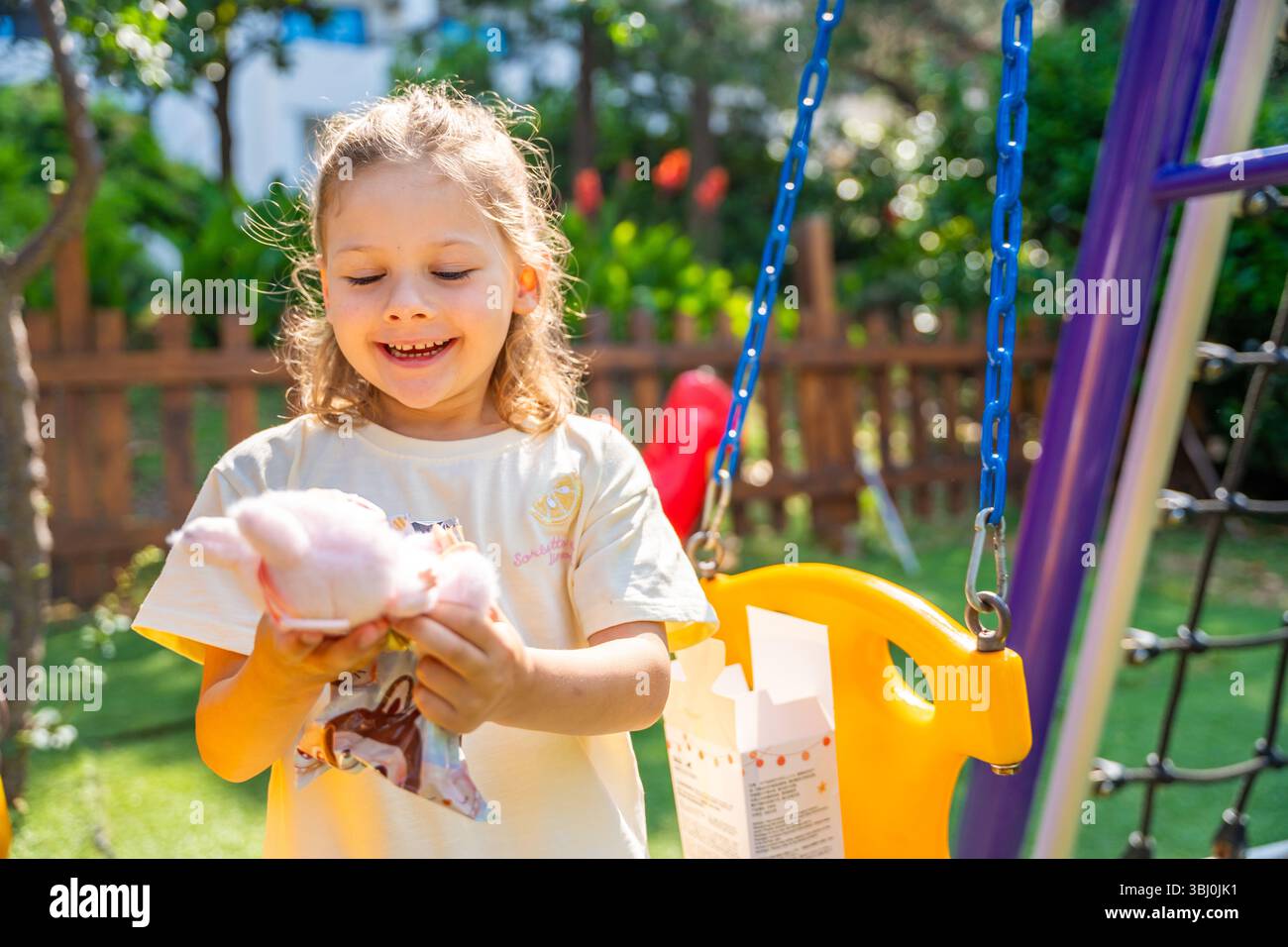 Budva, Montenegro - June 12, 2025: Little girl proudly showing pink ...
