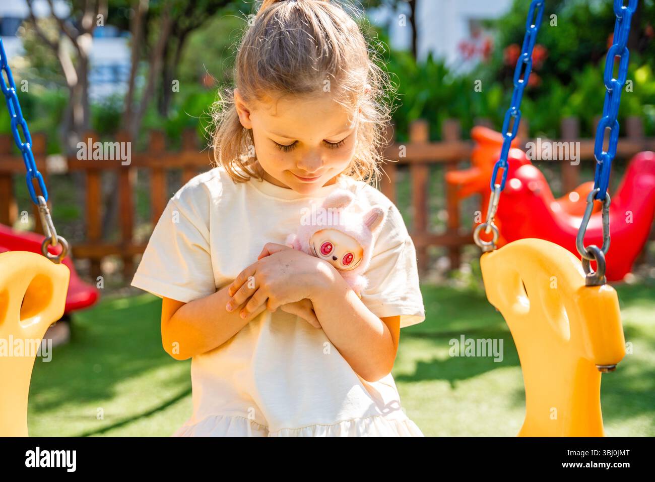 Budva, Montenegro - June 12, 2025: Little girl playing with pink Dada ...