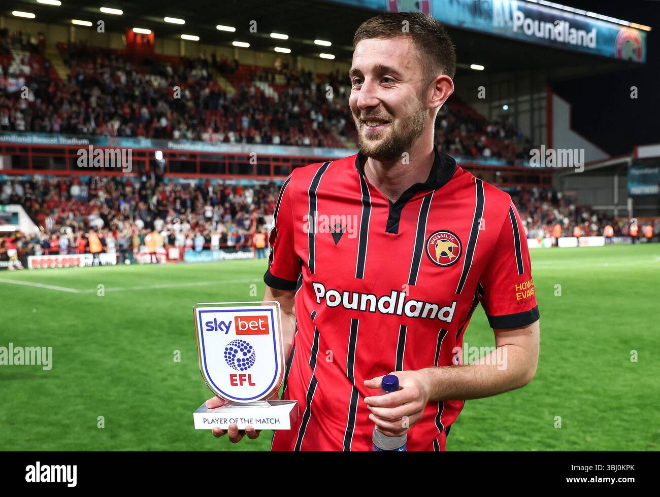 Walsall's Harry Williams with his man of the match trophy following the ...
