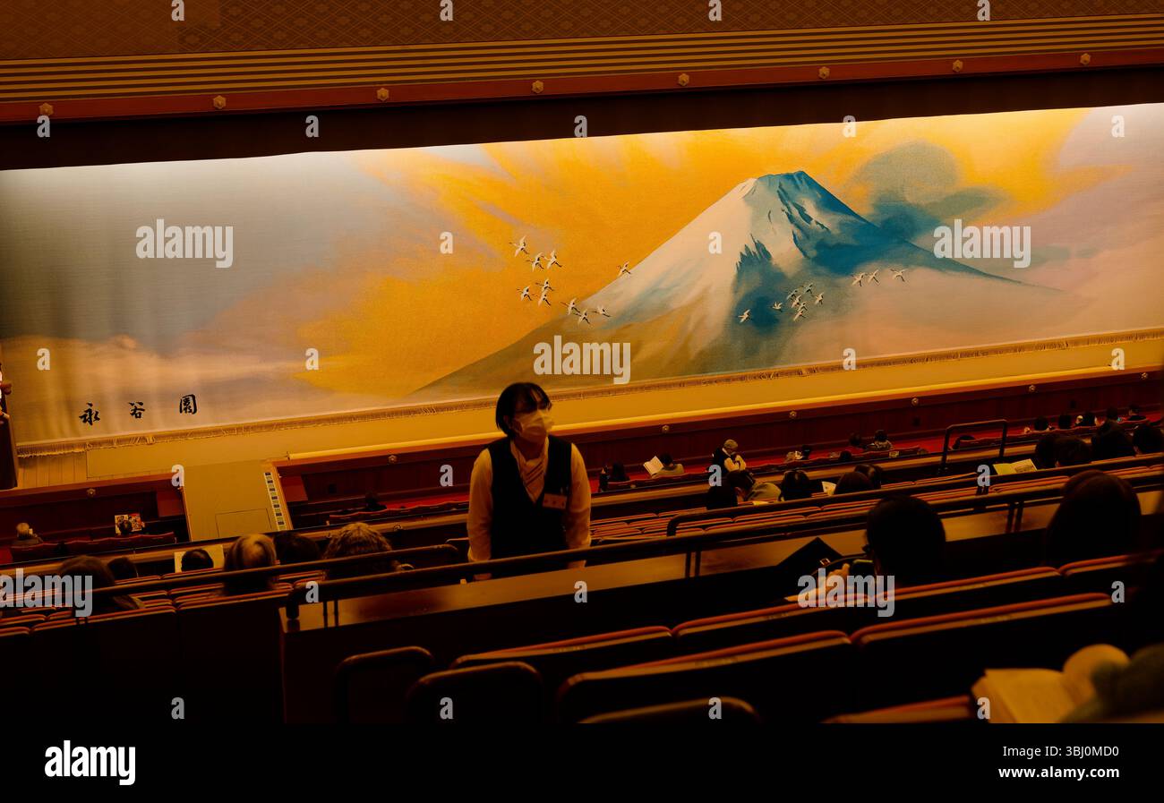 Inside the historic Kabuki-za Theatre with a grand curtain depicting ...
