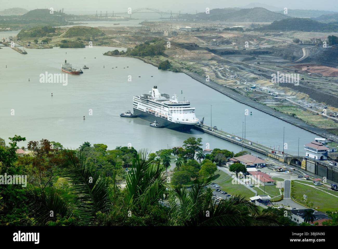Aerial view of the Panama Canal with a cruise ship entering a lock ...