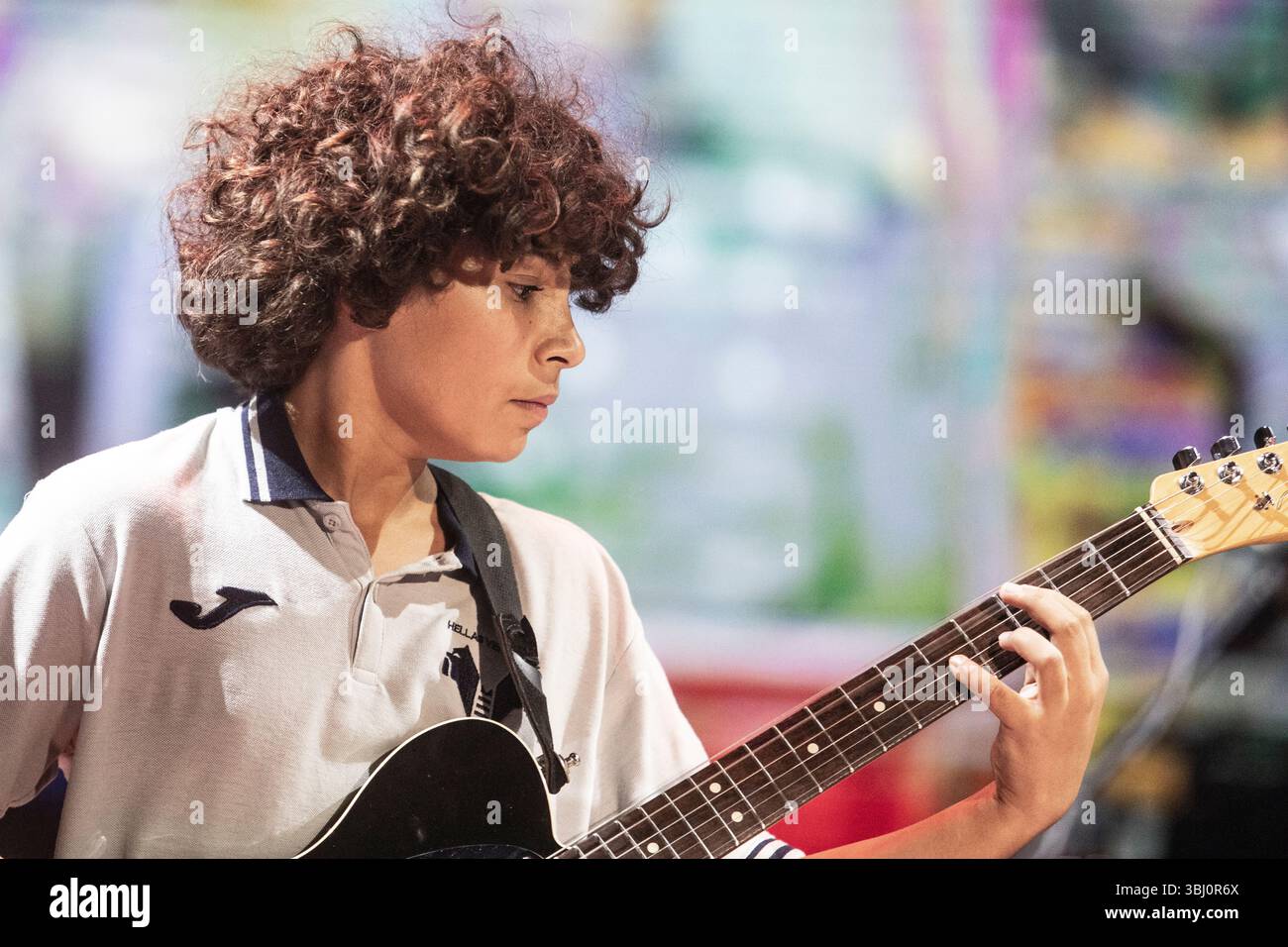 Roman, son of American musician Tom Morello, performs during a concert ...