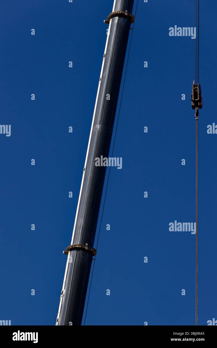 Hydraulic crane boom extended at Radcliffe hub construction site town ...