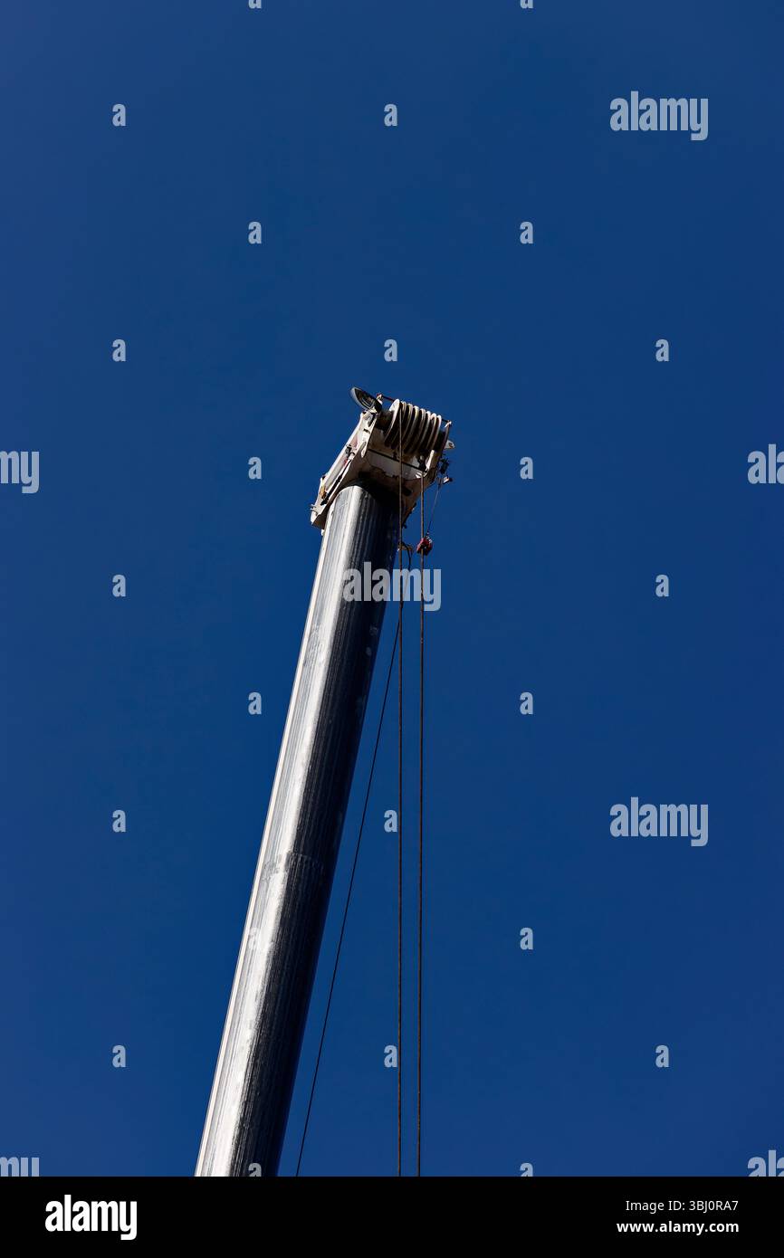 Hydraulic crane boom extended at Radcliffe hub construction site town ...