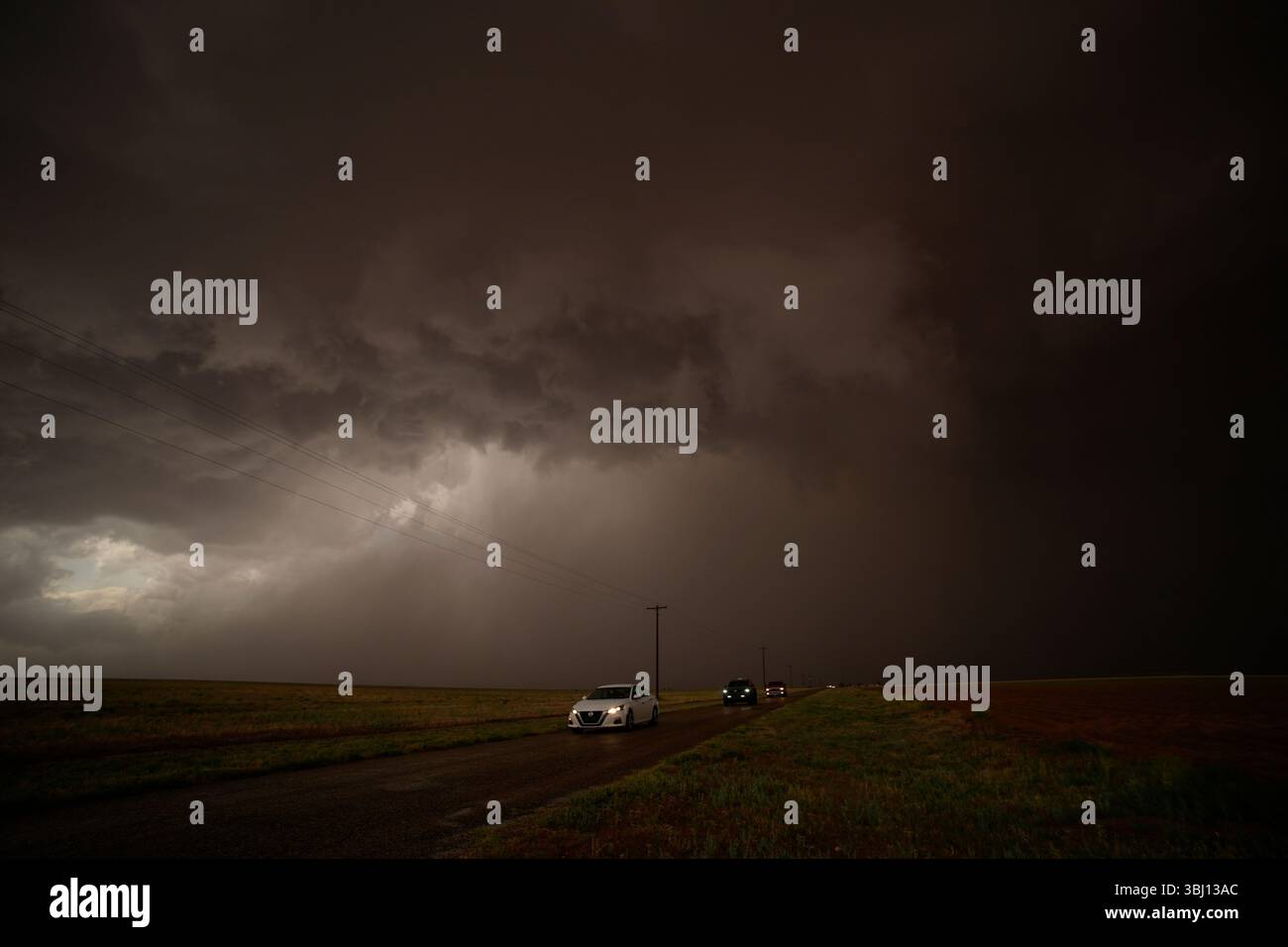 Cars dive away from a storm during a Project ICECHIP operation Thursday ...