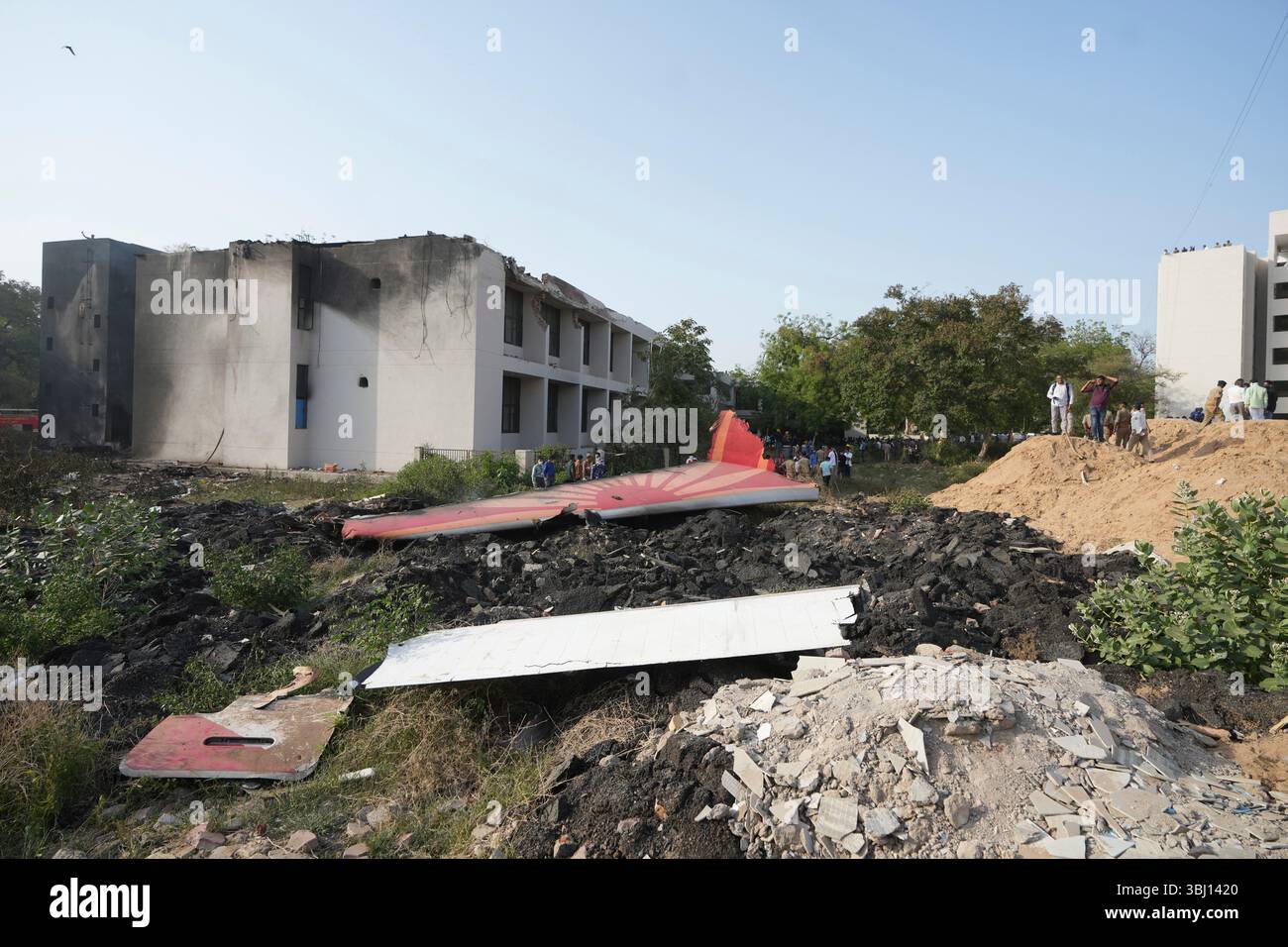 The debris of an airplane lies on a slope after it crashed in India's ...