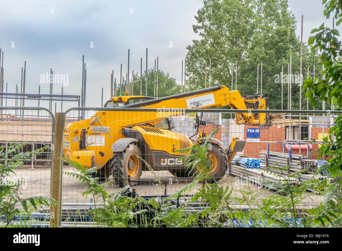 Miller Homes new development in Blakedown, Midlands, UK. JCB lifting ...