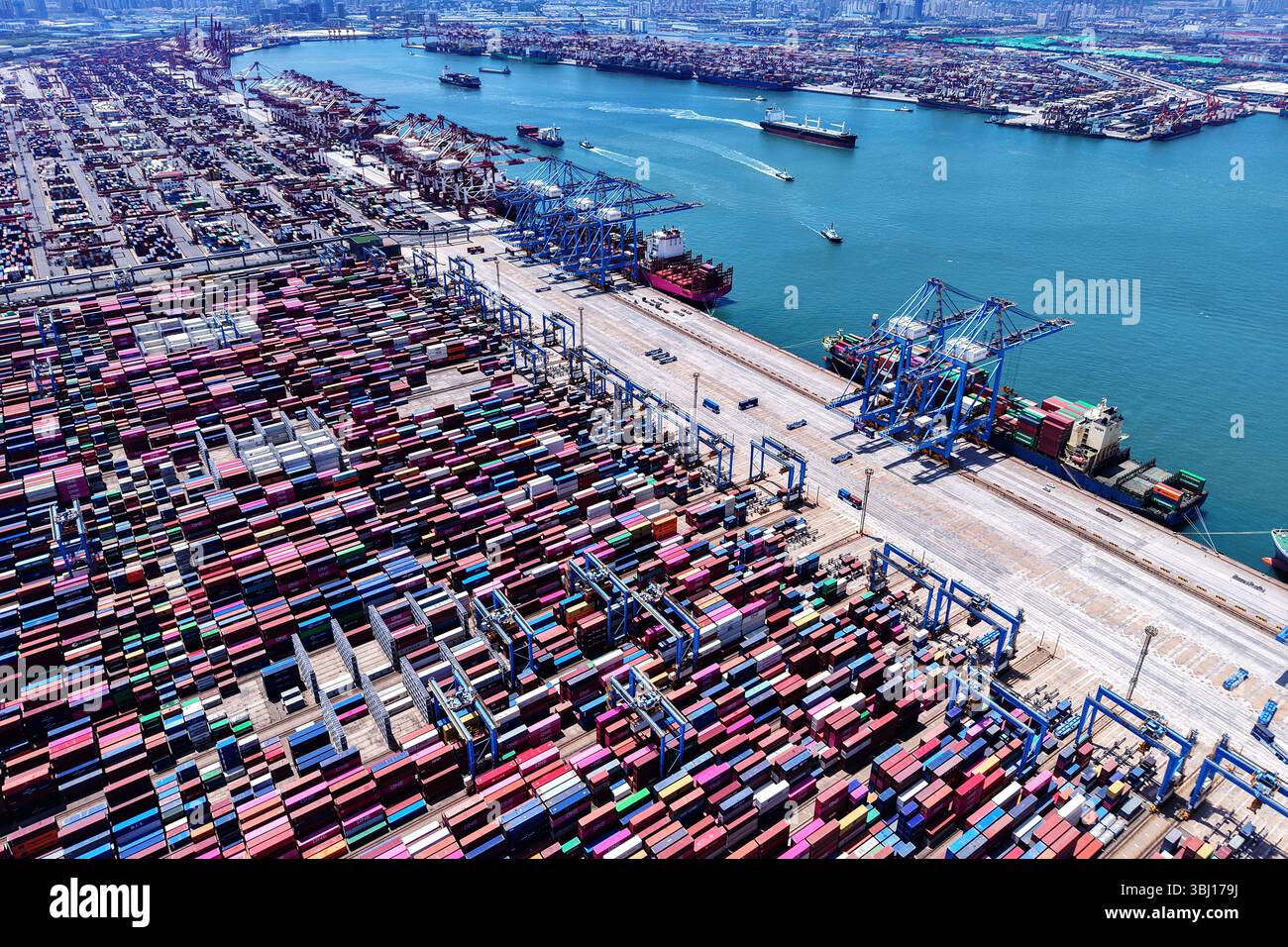 Cargo ships are constantly flowing in and out of the channel of Qingdao ...
