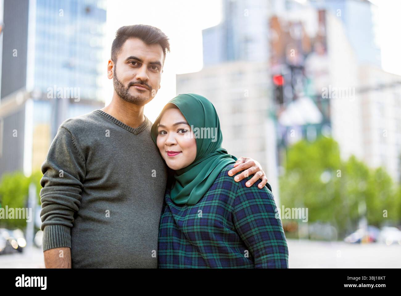 Portrait of happy muslim couple embracing each other in the city Stock ...
