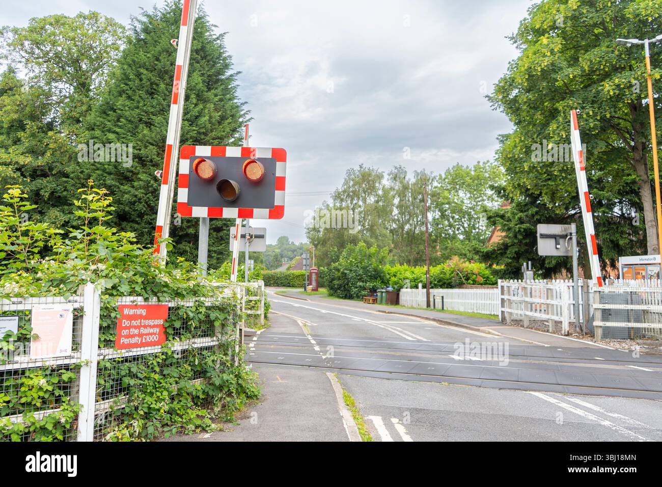 Open level crossing at Blakedown railway station with two red lights ...