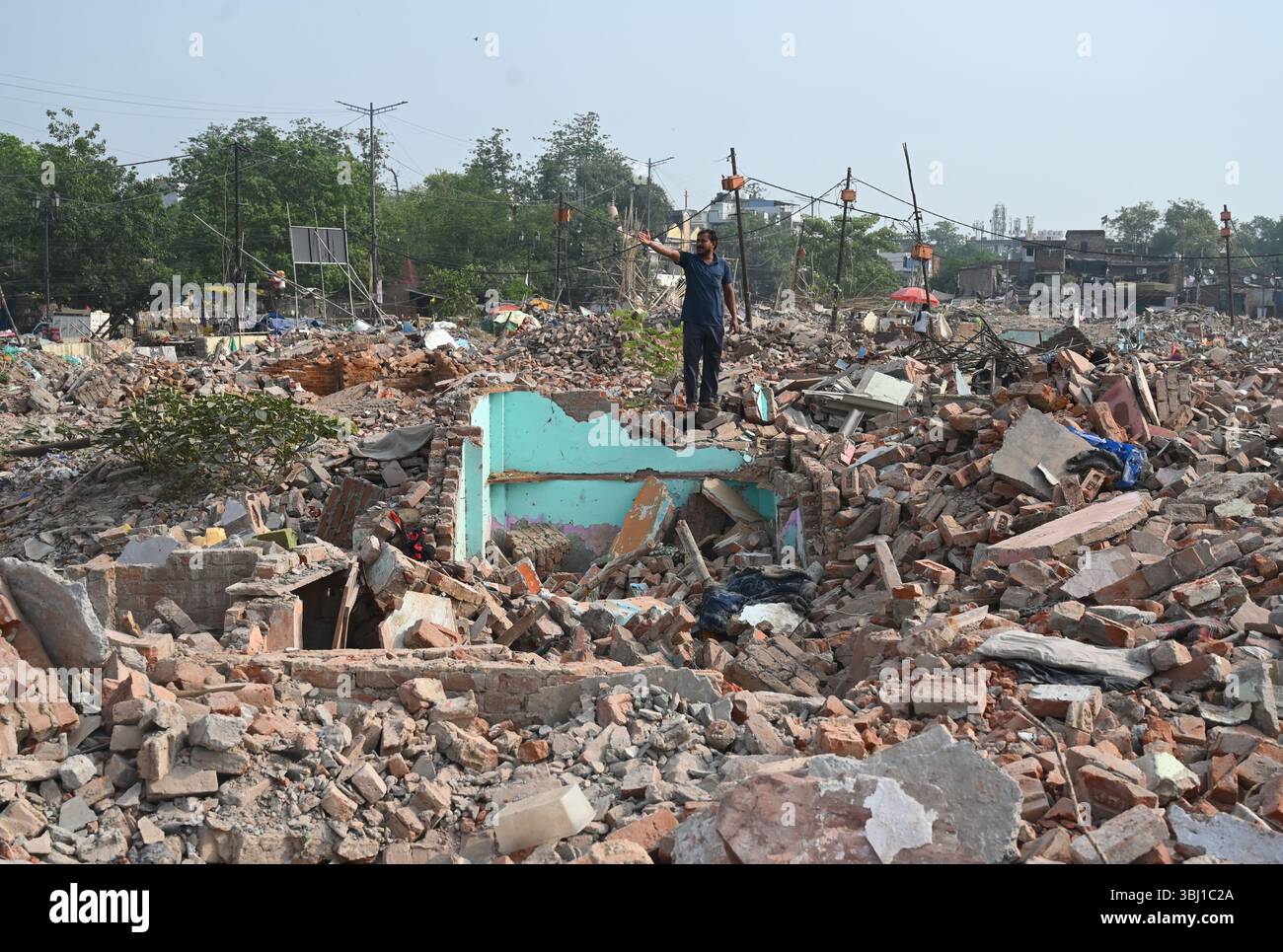 NEW DELHI, INDIA - JUNE 12: People searching for valuables from the ...