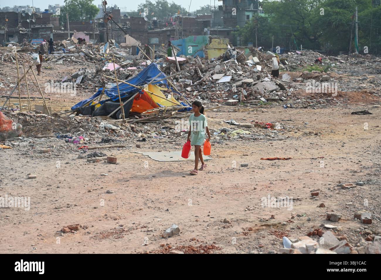 NEW DELHI, INDIA - JUNE 12: People salvaging valuables from the debris ...