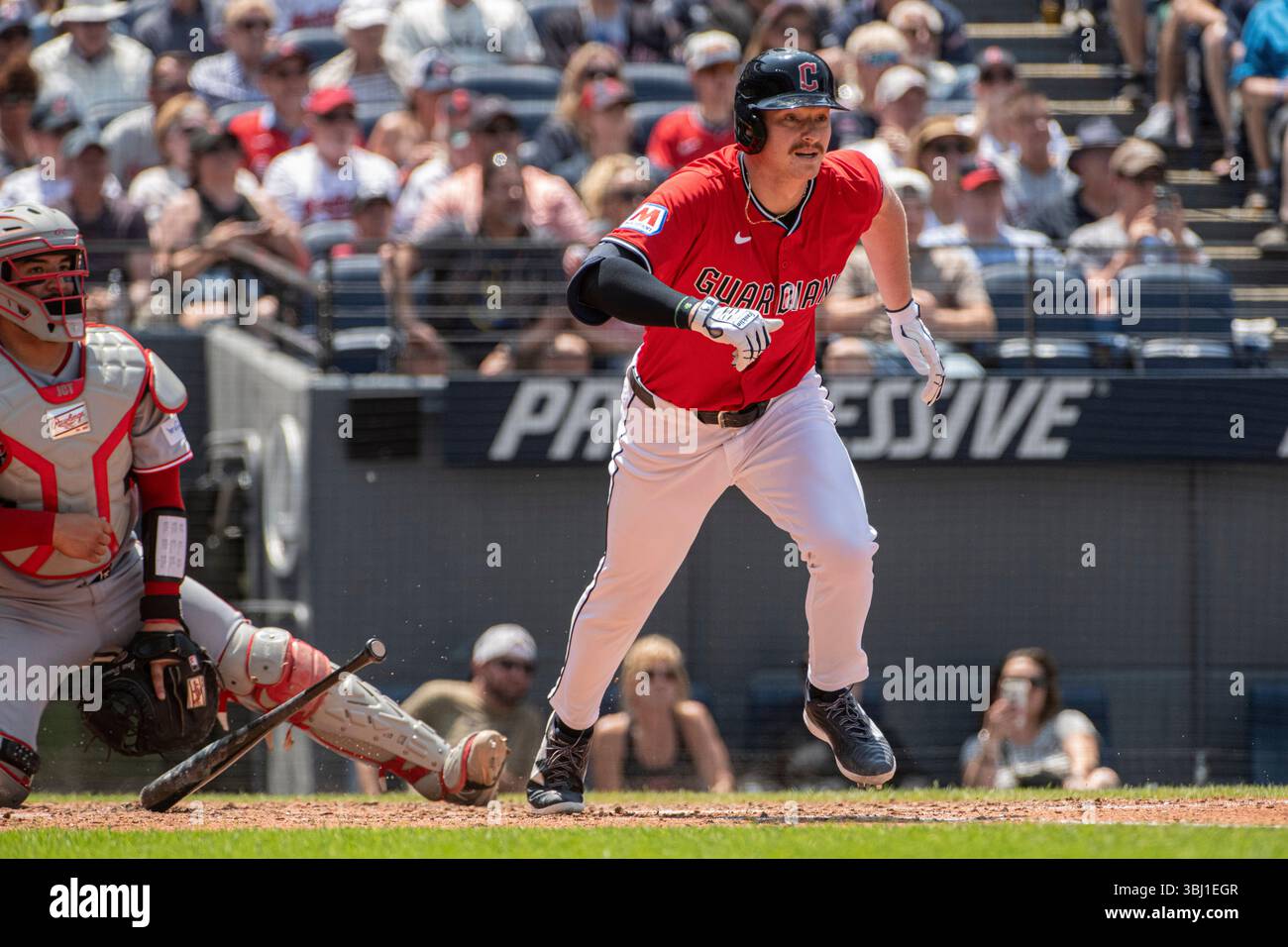 Cleveland Guardians' Kyle Manzardo, right, watches his two-run RBI ...