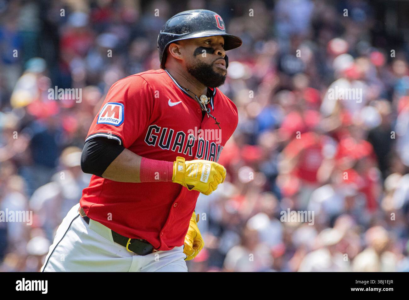 Cleveland Guardians' Carlos Santana watches his grand slam home run off ...