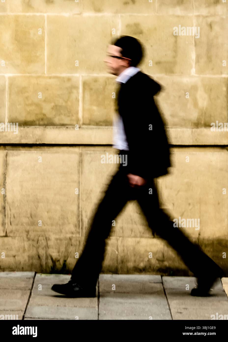 Pedestrian walking past white hi-res stock photography and images - Alamy