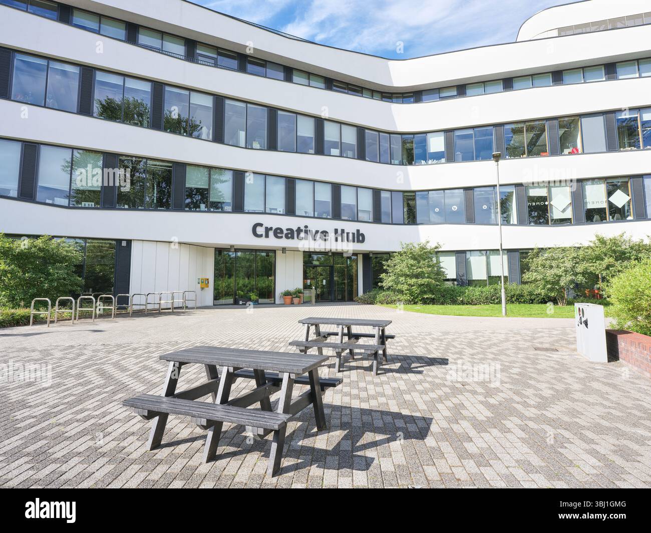 Picnic benches in the courtyard outside the Creative hub building at ...
