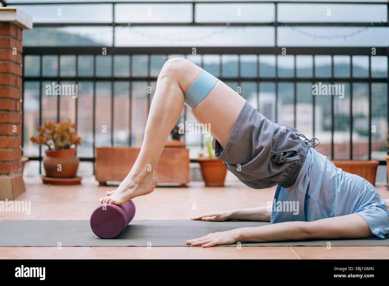 Targeted glute bridge with foam roller and band for hypermobility ...