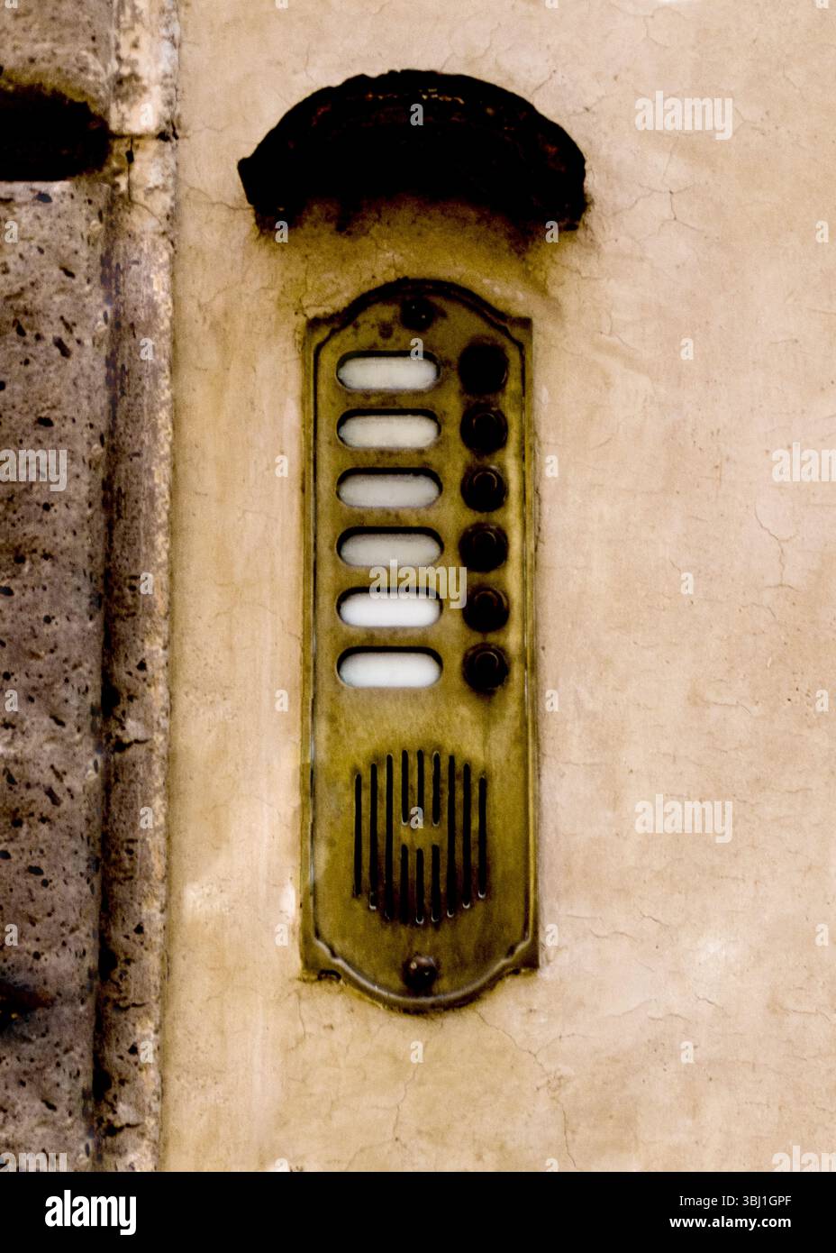 An old intercom system is mounted on a wall Stock Photo - Alamy