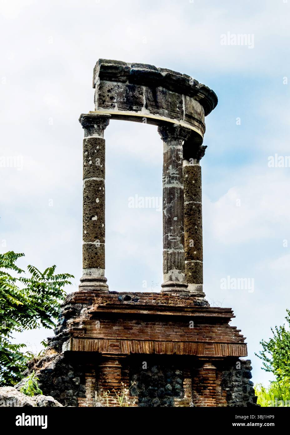 An image of an ancient Roman ruin, featuring three columns supporting ...