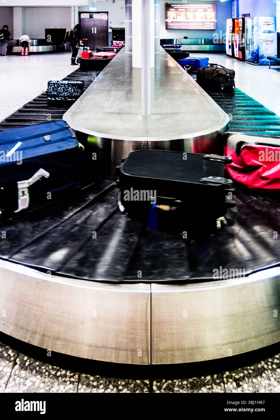 Baggage bags moving on arrival hi-res stock photography and images - Alamy