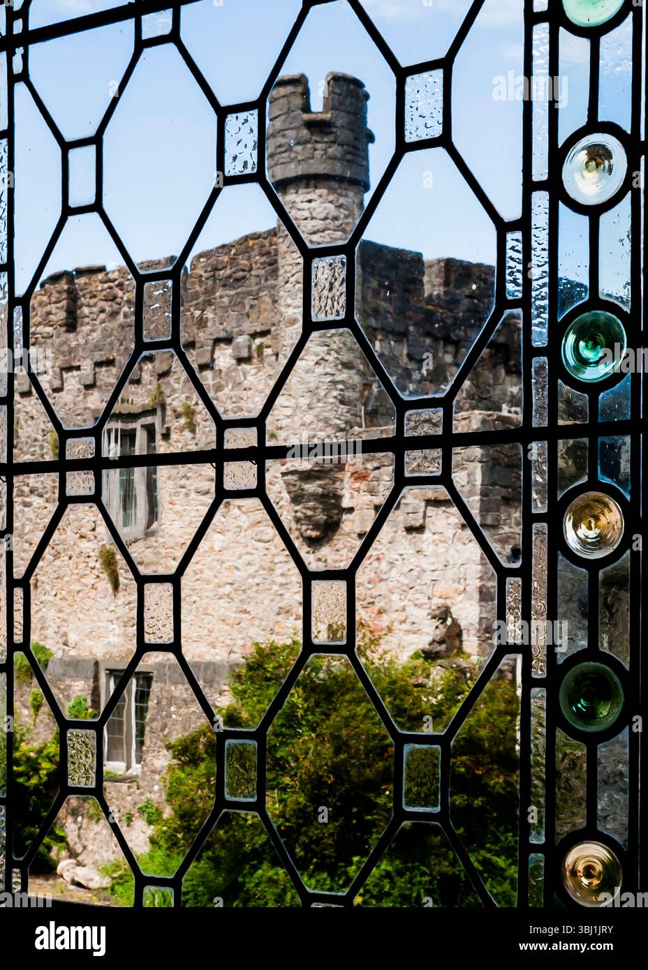 A view of a castle through a stained glass window Stock Photo - Alamy