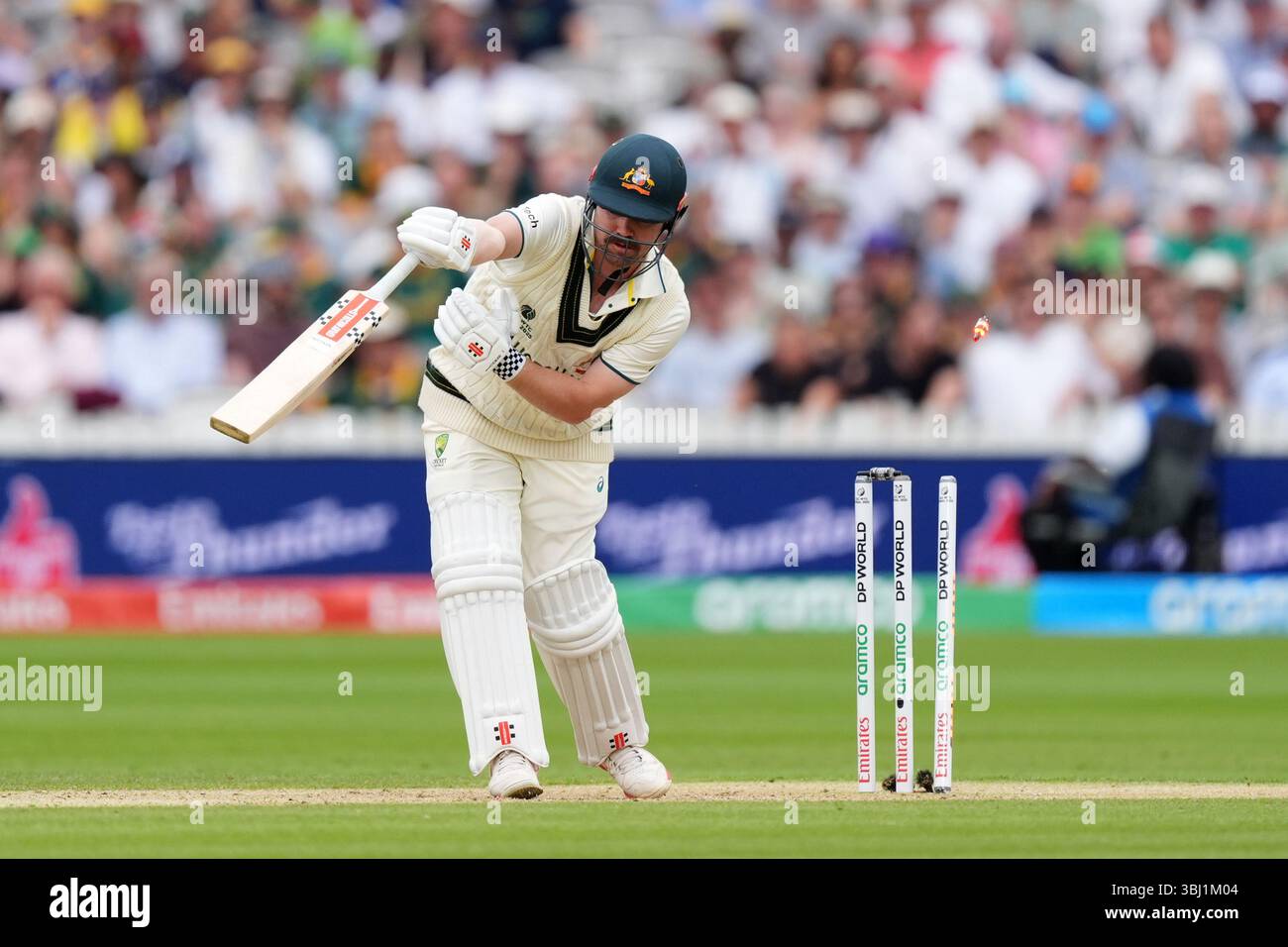 Australia's Travis Head is bowled by South Africa's Wiaan Mulder on day ...