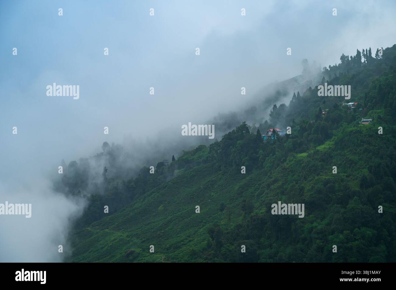 Monsoon clouds passing over Himalayan mountains of Darjeeling, West ...