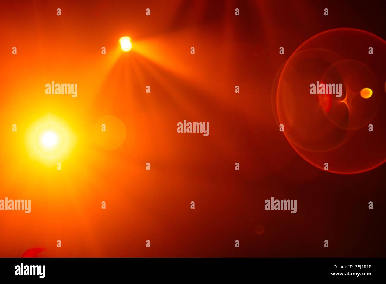 Abstract Orange and Red Light Beams with Lens Flare Stock Photo - Alamy