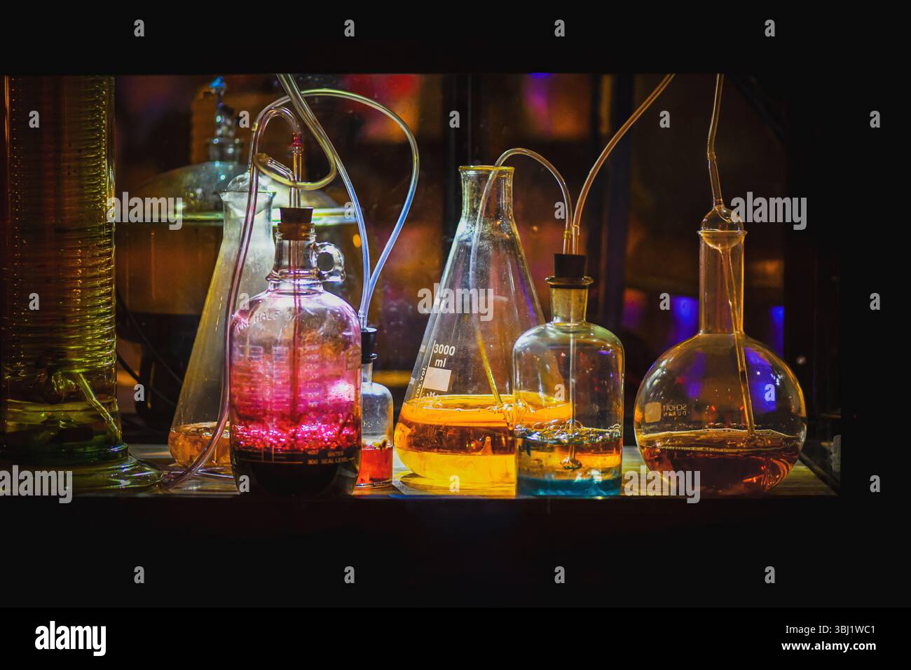 Scientist in lab with colorful beakers hi-res stock photography and ...