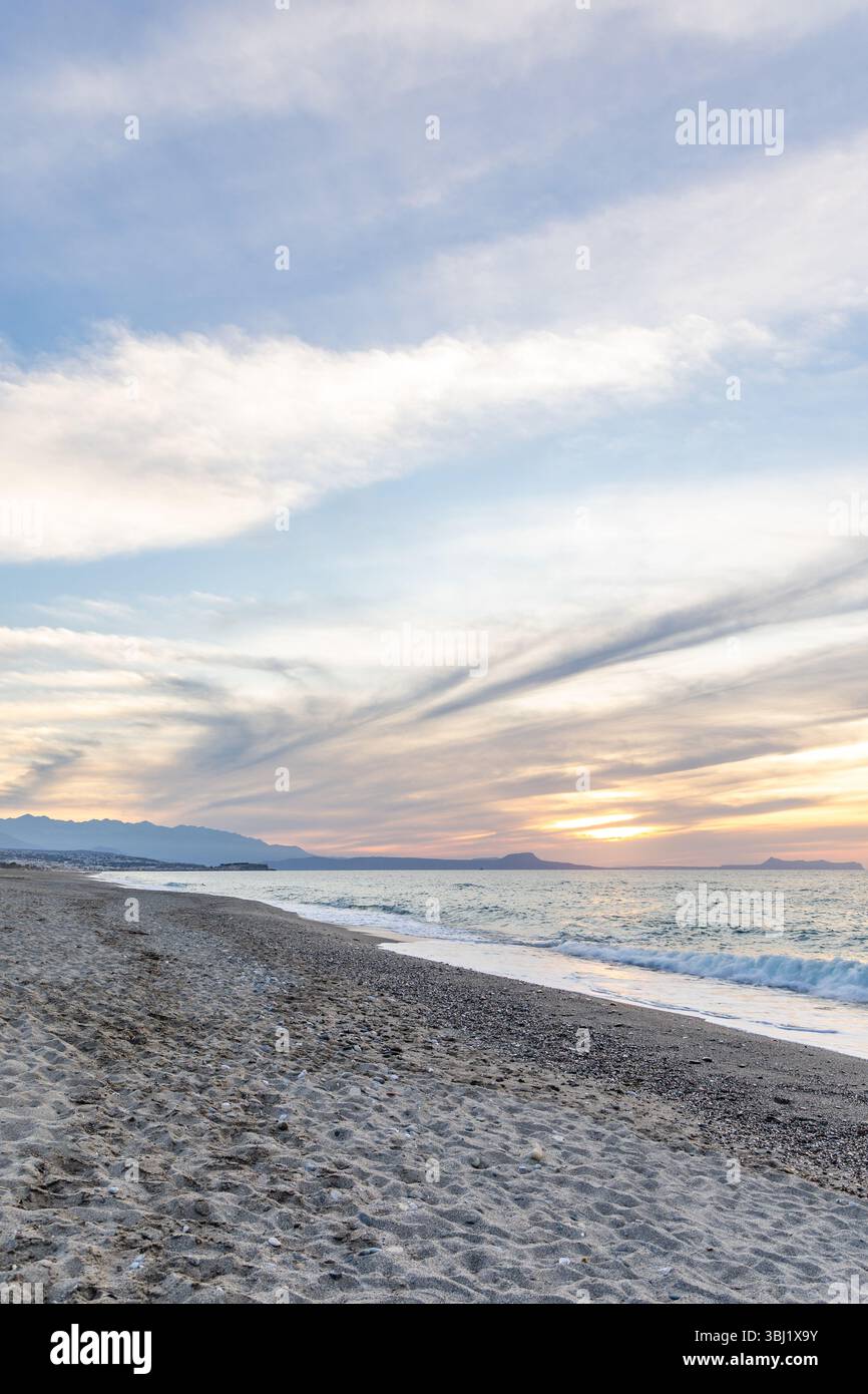 Beautiful coastline with a sandy and pebble beach at sunset. Beautiful ...