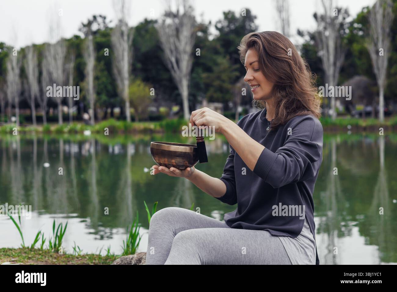 Woman wears gray sweater hi-res stock photography and images - Alamy