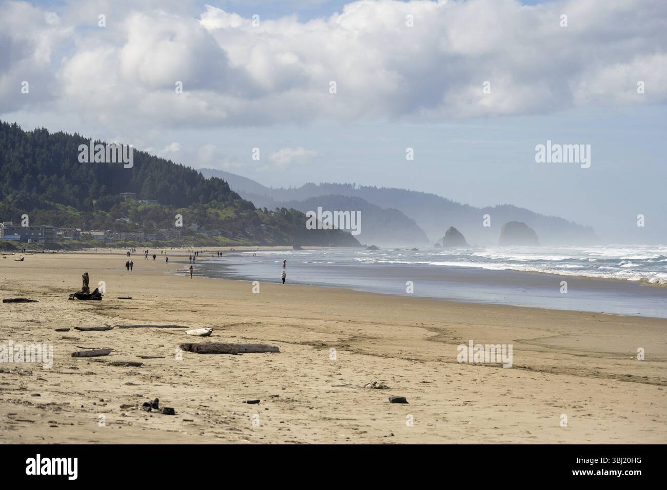Sunny beach with large rocks in the sea and clear blue sky, peaceful ...