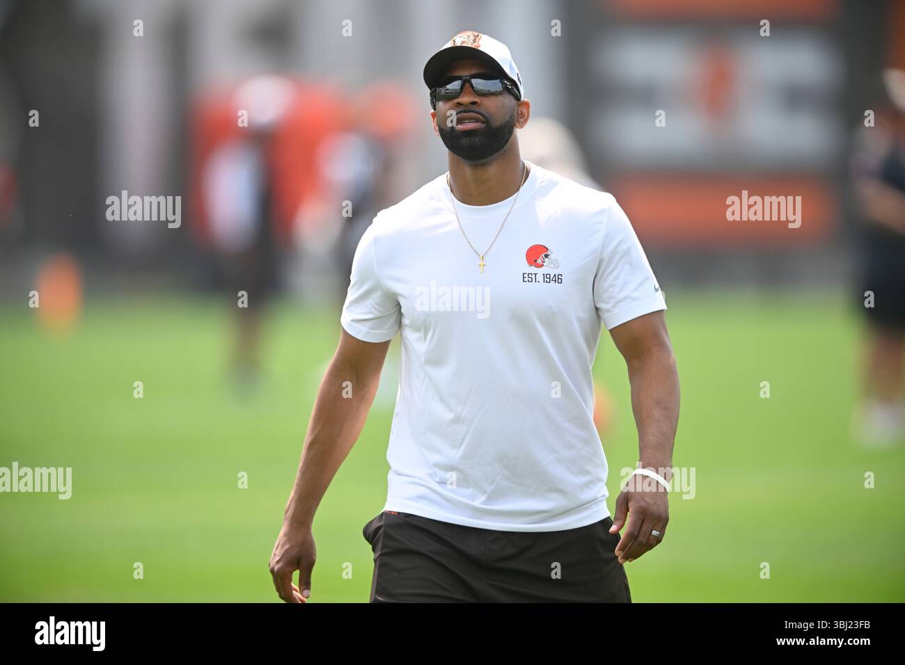 Cleveland Browns general manager Andrew Berry walks on the field during ...