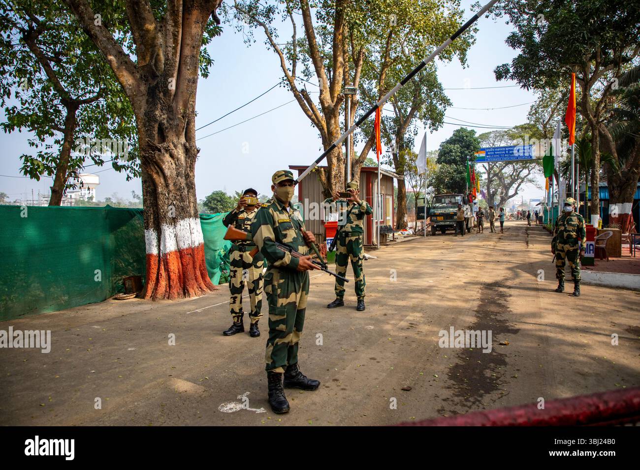 Members of the Border Security Force (BSF) stand guard at the Agartala ...