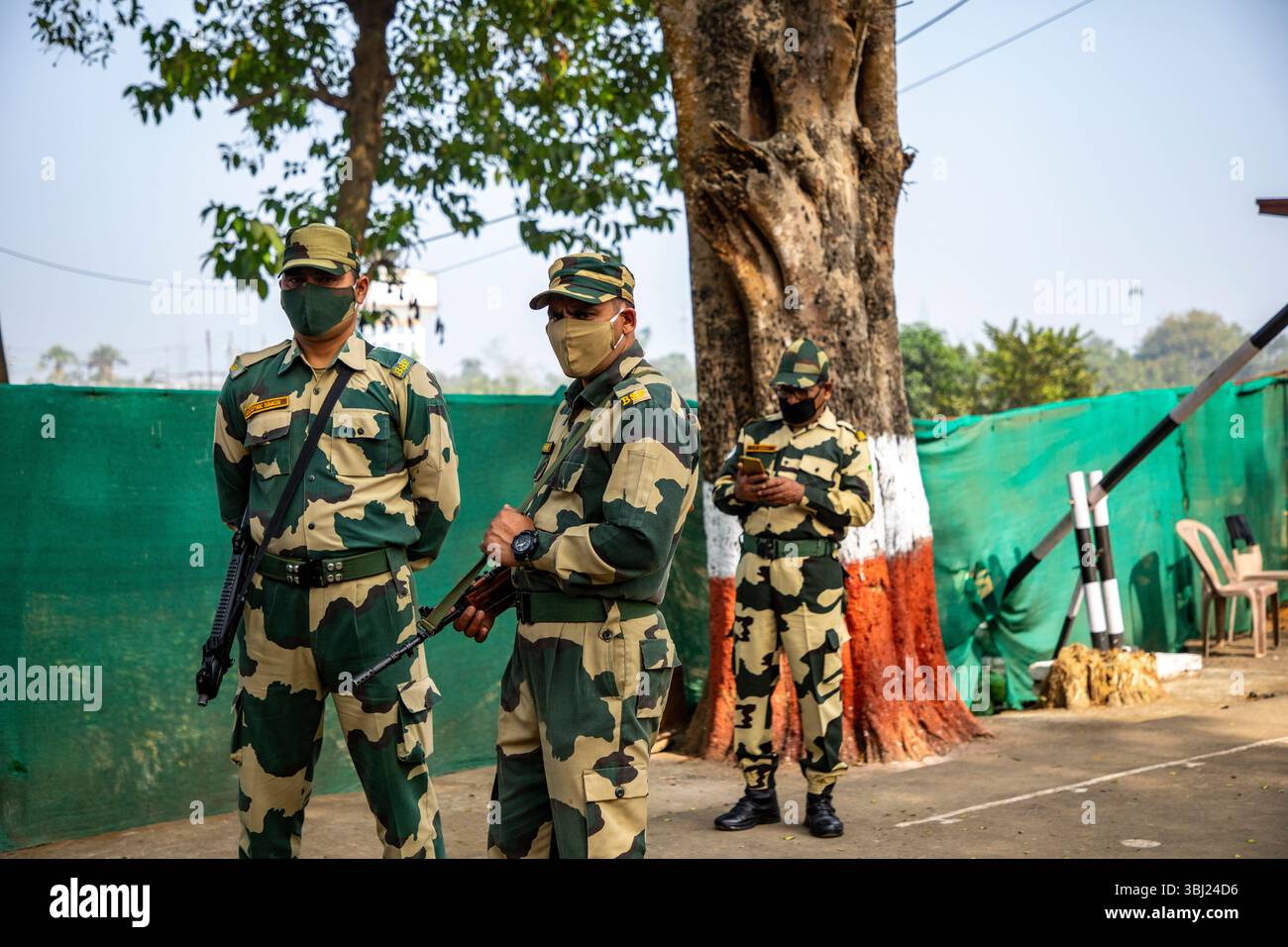Members of the Border Security Force (BSF) stand guard at the Agartala ...