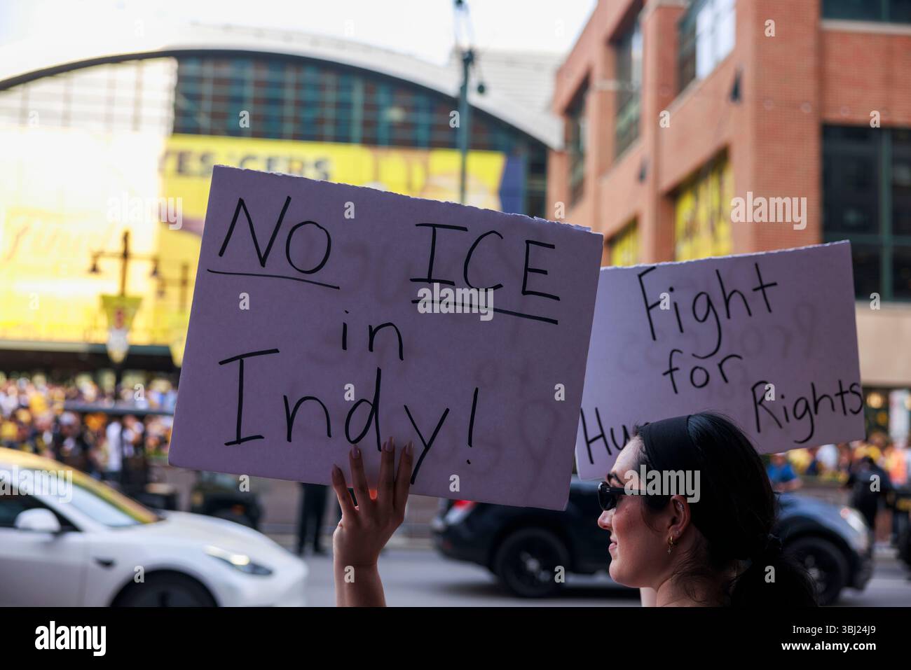Indianapolis, Indiana, USA. 11th June, 2025. A woman holds a placard ...