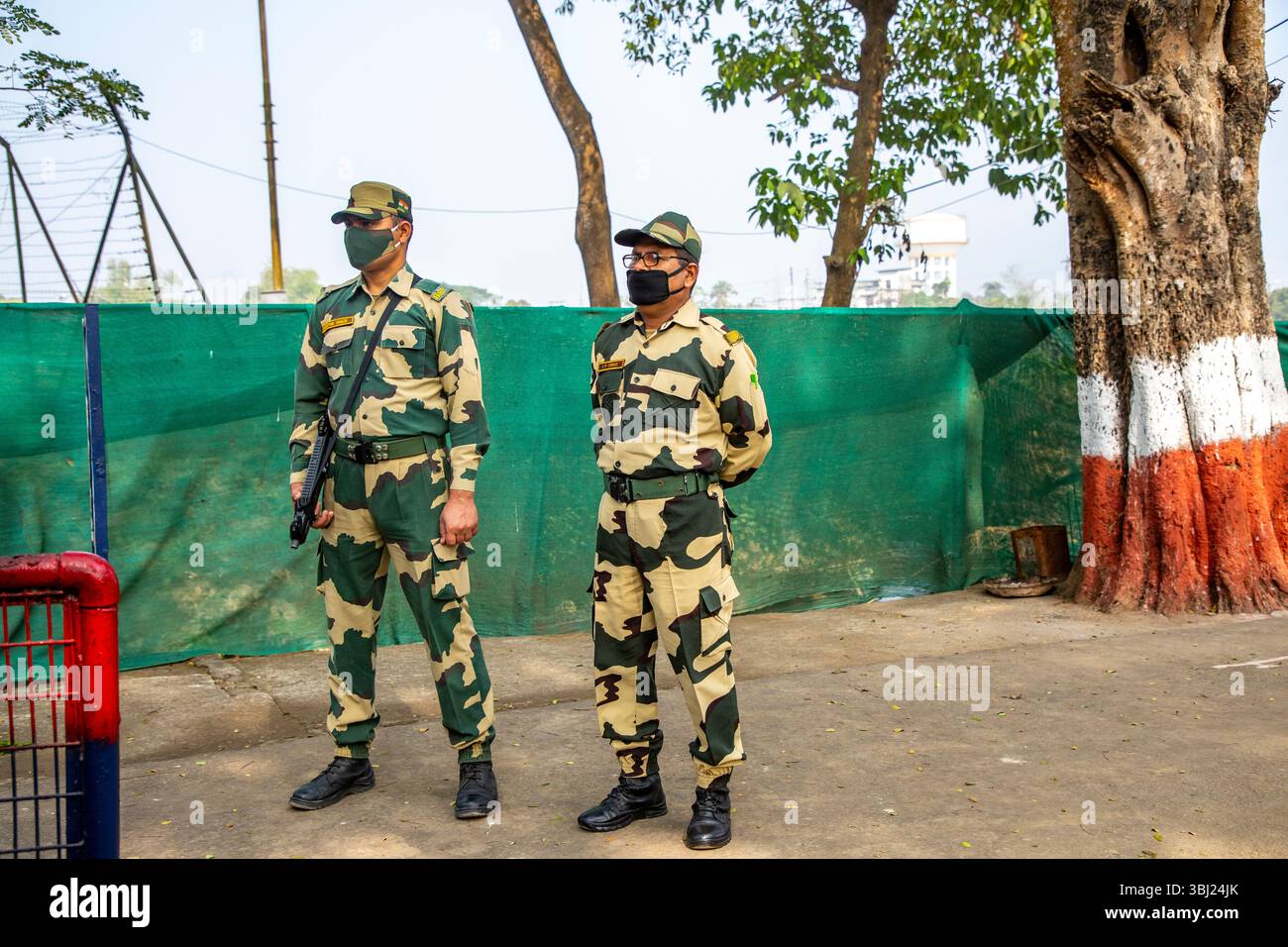 Members of the Border Security Force (BSF) stand guard at the Agartala ...